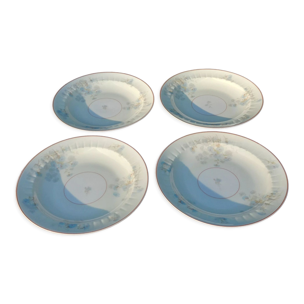 Lot de quatre assiettes creuse en porcelaine de Limoges signé Robert ...